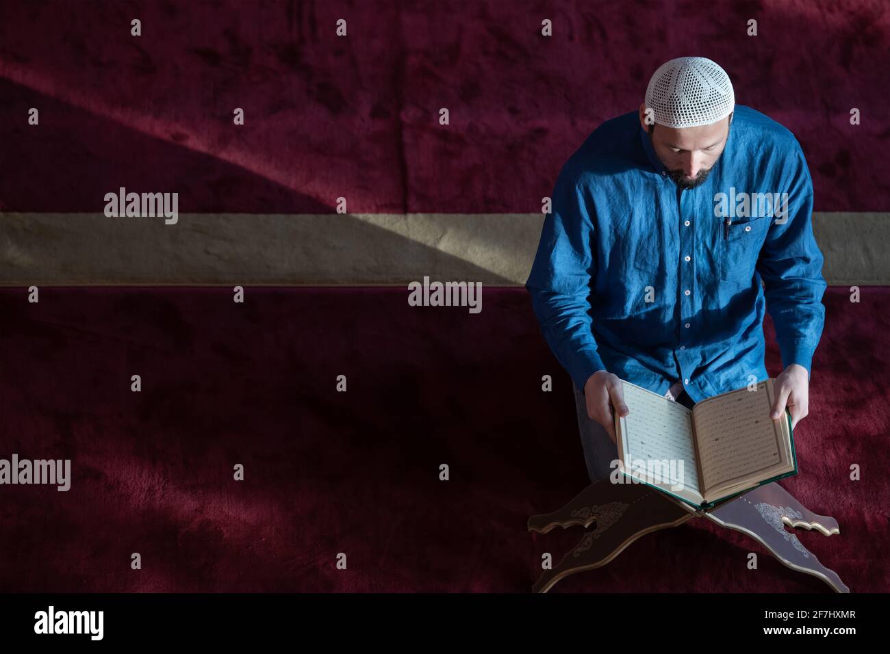 muslim man praying Allah alone inside the mosque and reading islamic ...