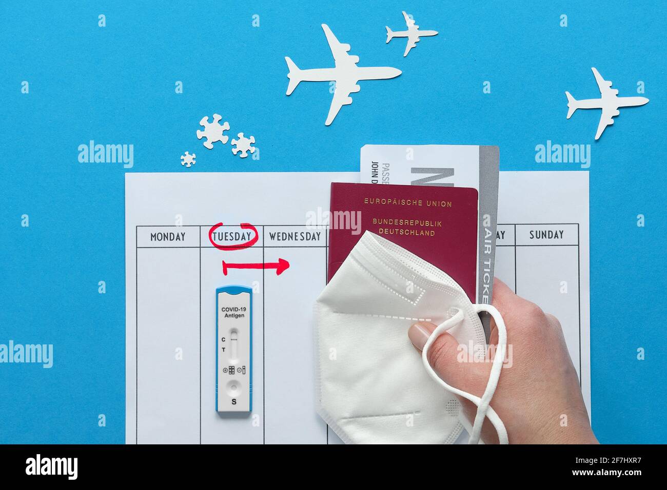 New normal travel during COVID-19 restrictions, flat lay on blue ...