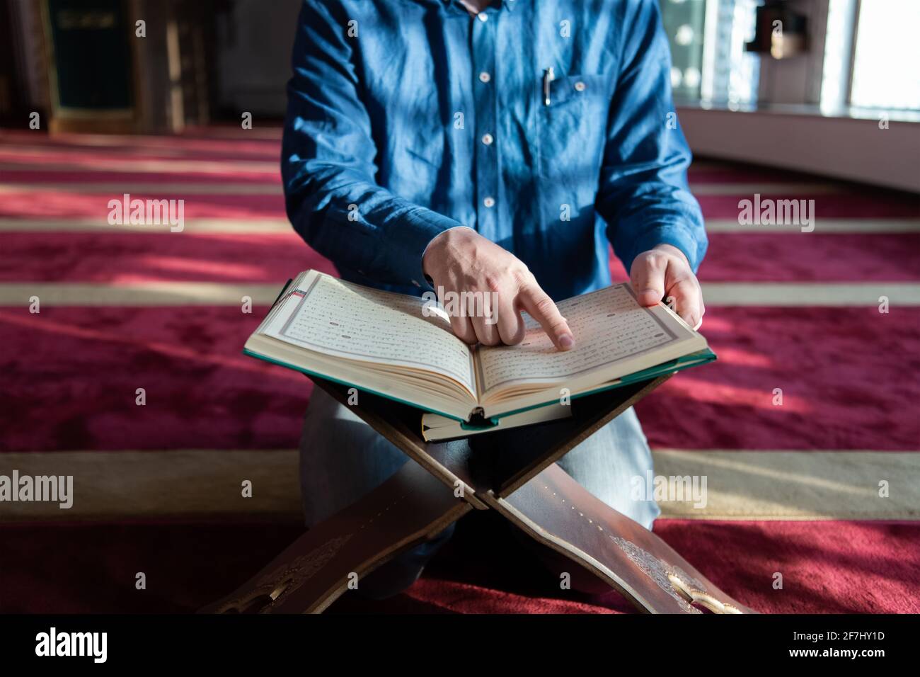 muslim man praying Allah alone inside the mosque and reading islamic ...