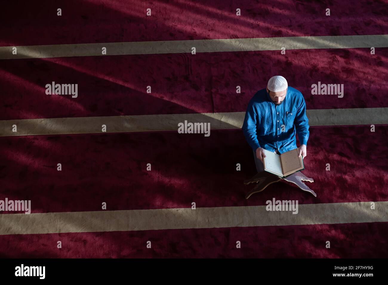 muslim man praying Allah alone inside the mosque and reading islamic ...
