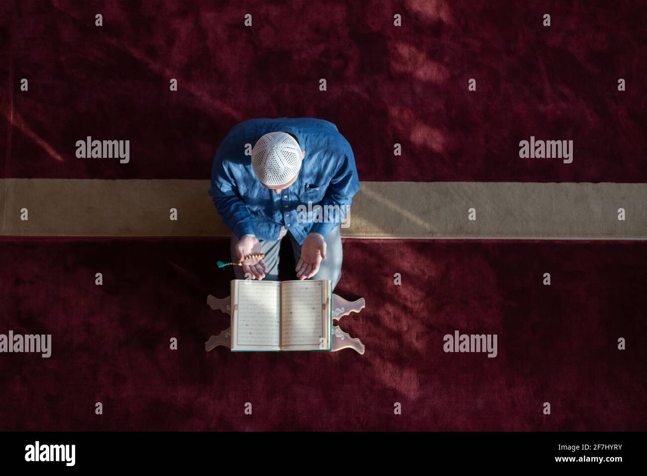 muslim man praying Allah alone inside the mosque and reading islamic ...