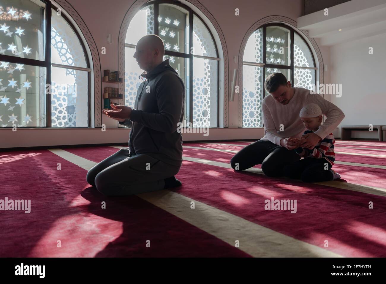 muslim prayer father and son in mosque praying and Stock Photo - Alamy