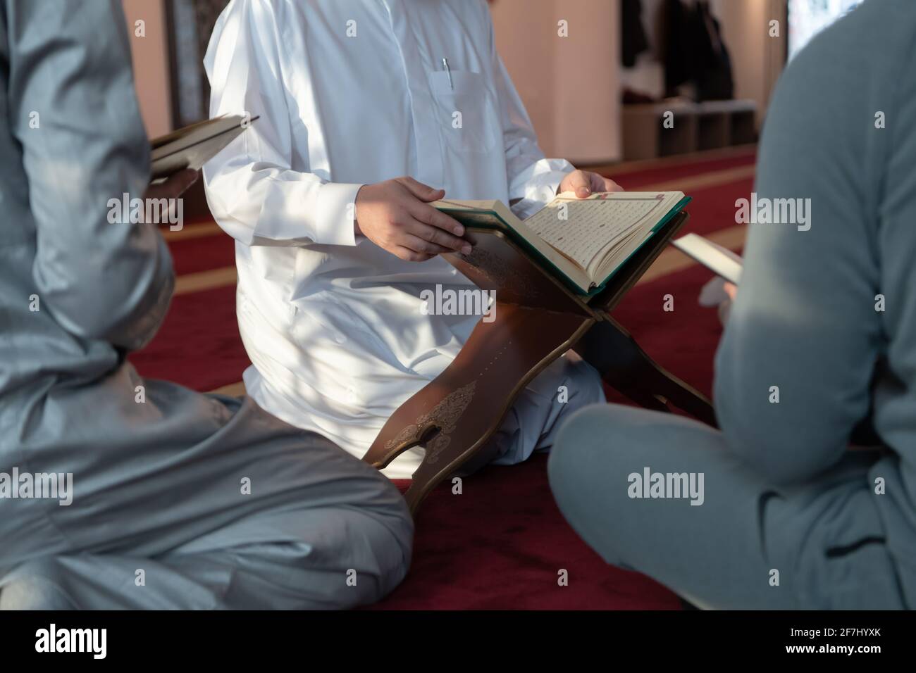 muslim people in mosque reading quran together Stock Photo - Alamy