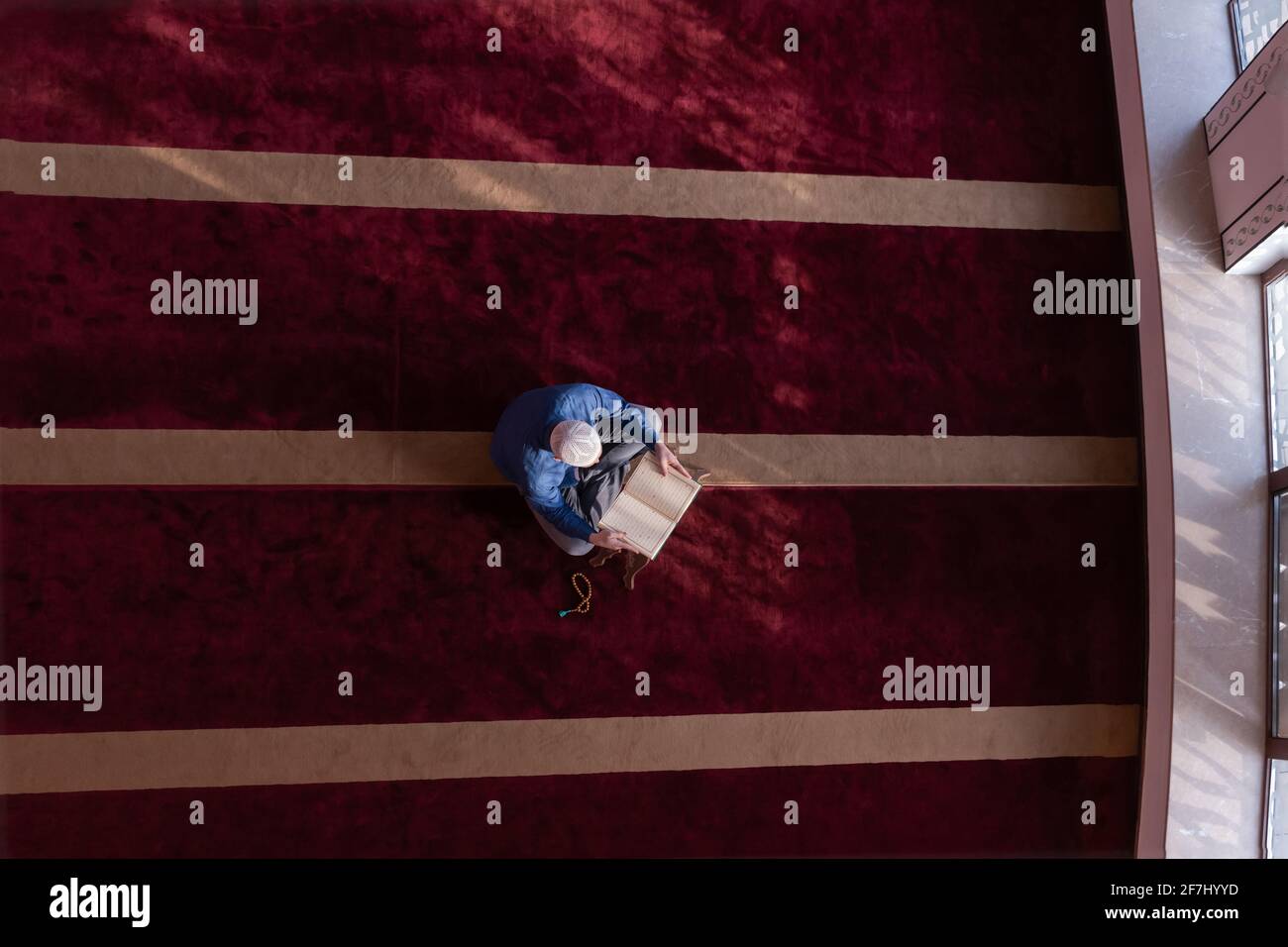 muslim man praying Allah alone inside the mosque and reading islamic ...
