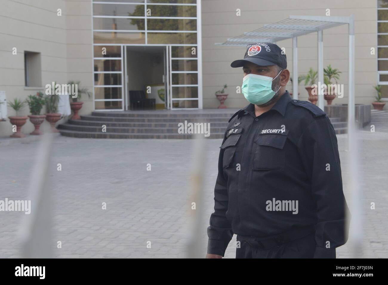 A security guard stands at the main entrance of the headquarters of ...