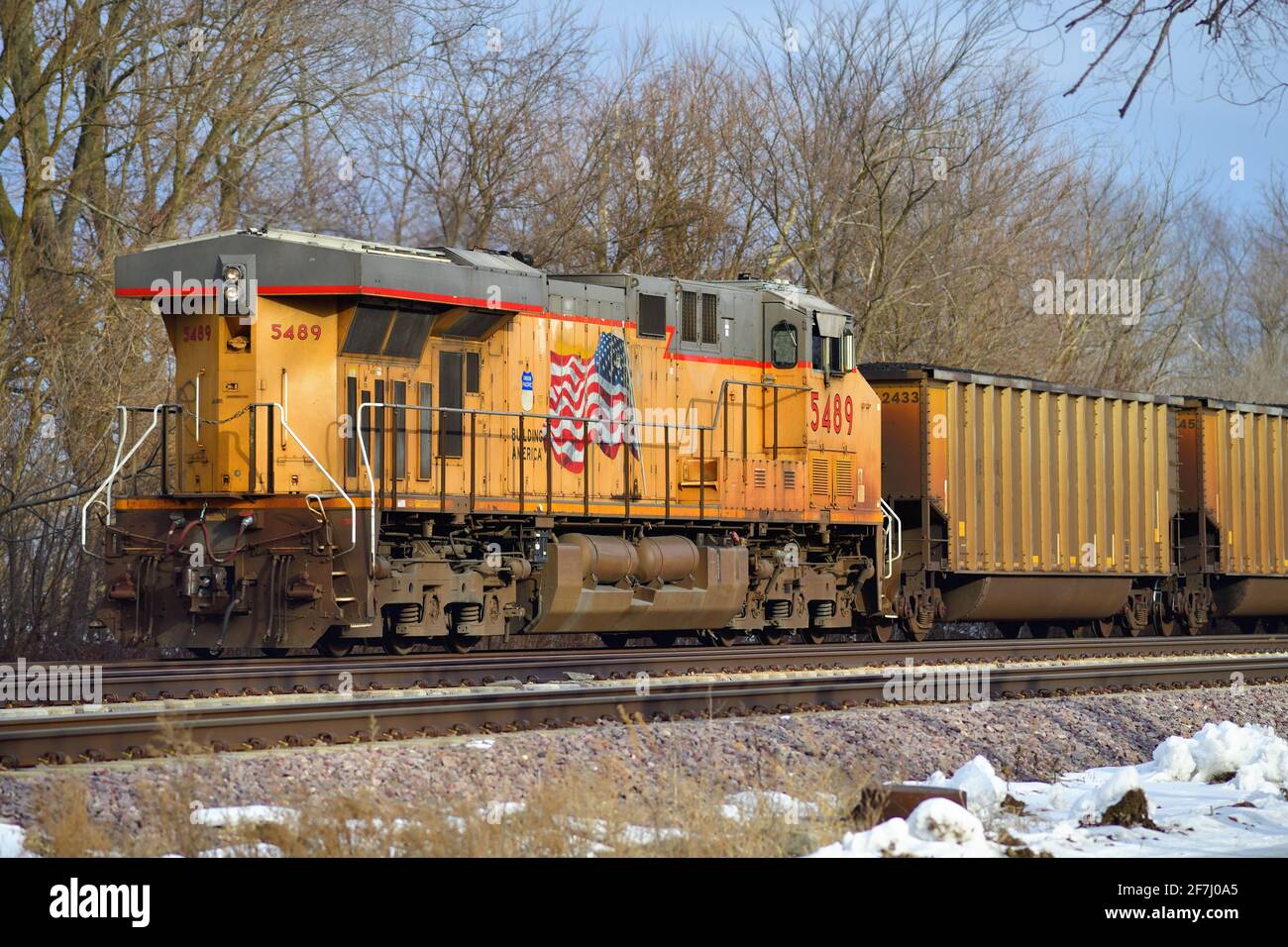 La Fox, Illinois, USA. A Union Pacific locomotive at the rear of a loaded coal train serves as a ...