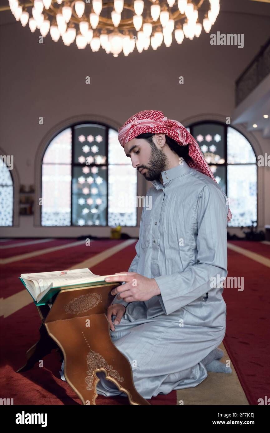 muslim man praying Allah alone inside the mosque and reading islamic ...