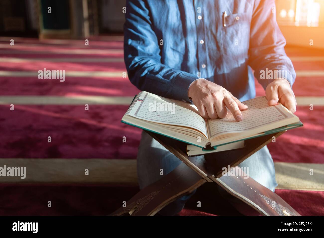 muslim man praying Allah alone inside the mosque and reading islamic ...