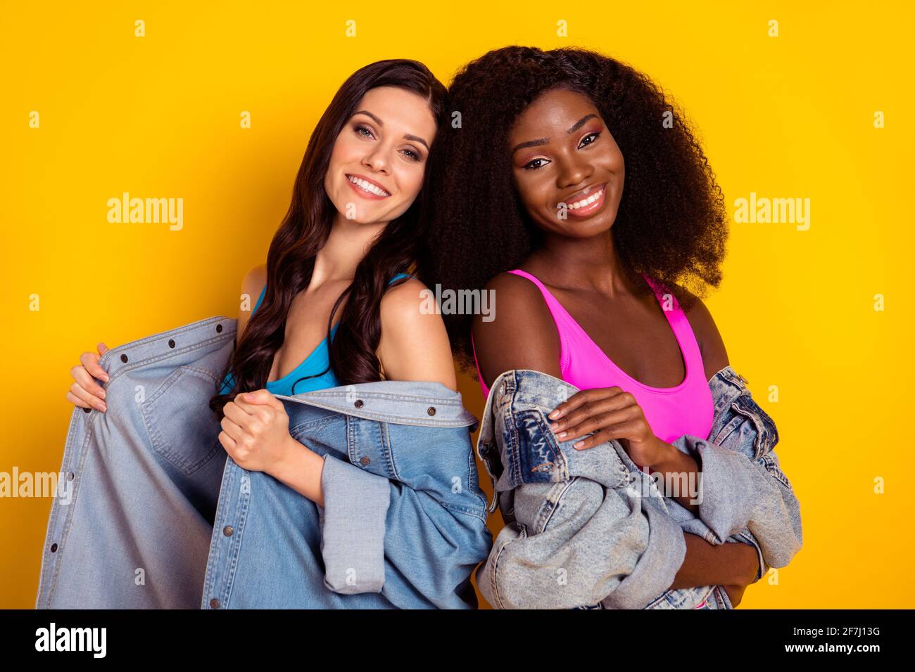 Photo of two young attractive girl best friend back-to-back happy ...