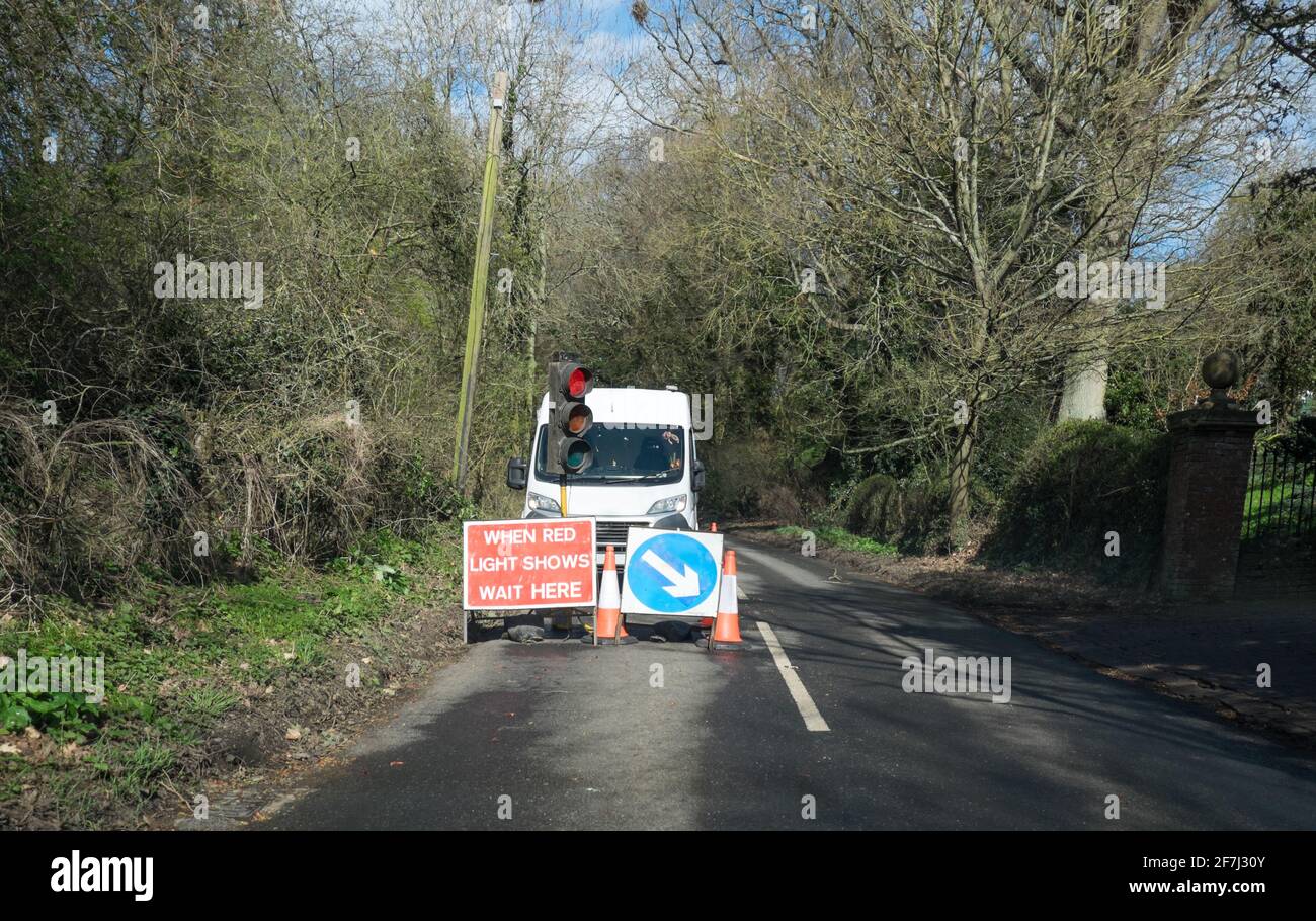 Road works with traffic light control on a rural country lane in Kent ...