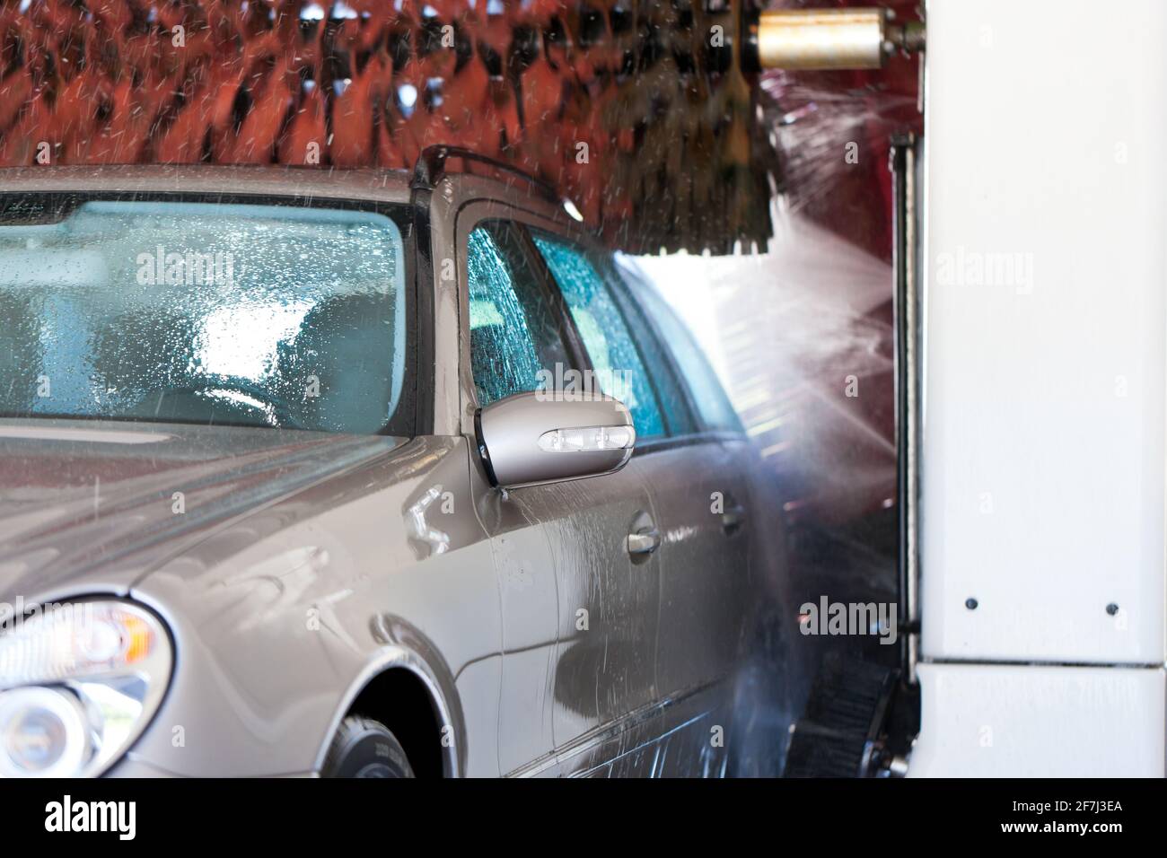 Car standing in a car wash Stock Photo - Alamy
