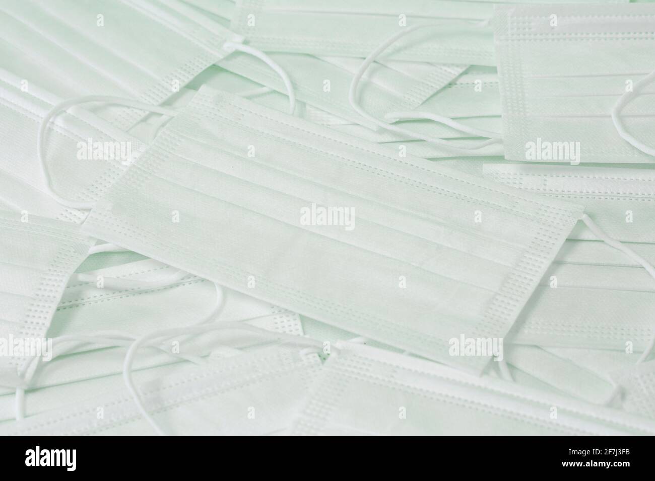 face mask, light green background Stock Photo - Alamy