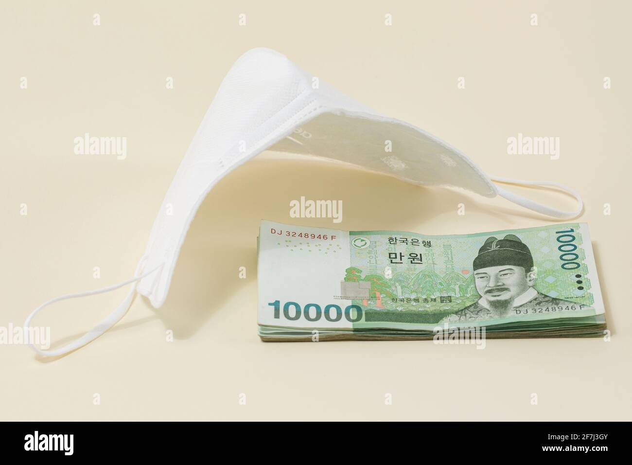 mask, money in yellow background Stock Photo - Alamy