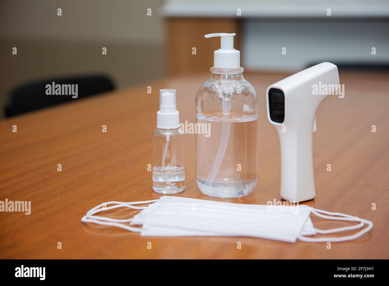 mask, hand sanitizer and thermometer Stock Photo - Alamy