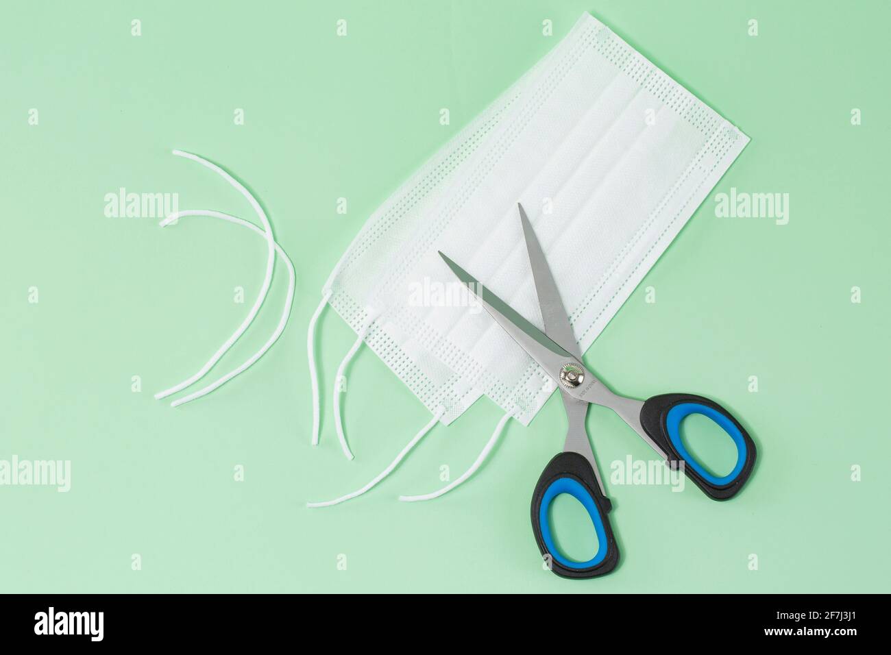 cut off the strings of mask Stock Photo - Alamy