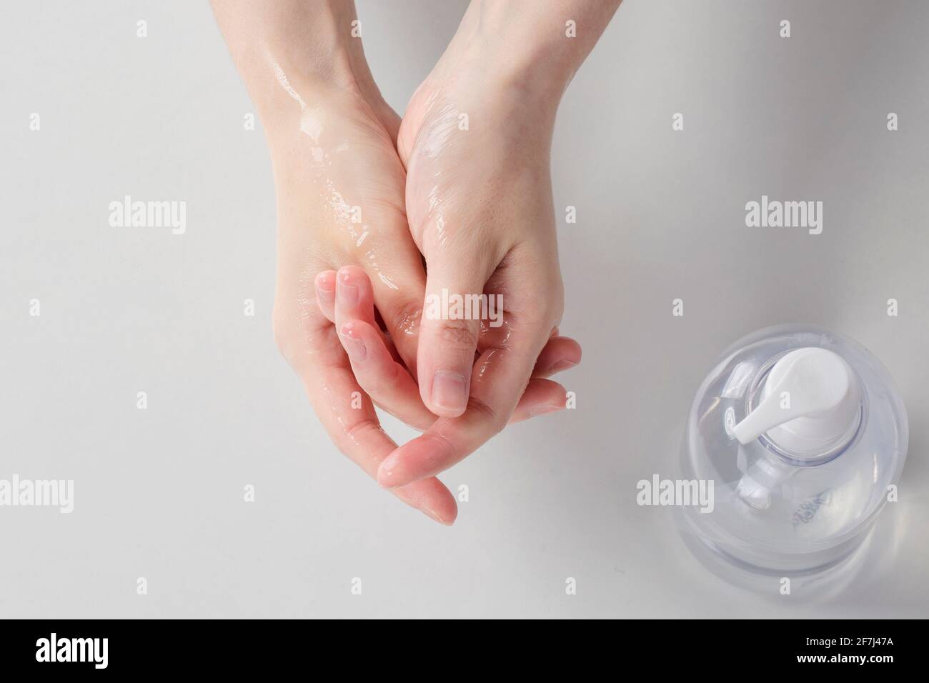 using hand sanitizer, disinfect hands Stock Photo - Alamy