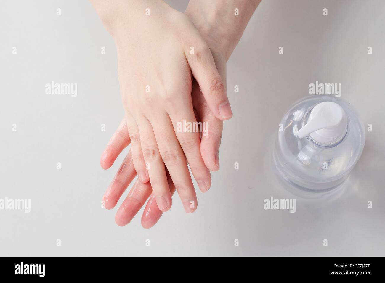 using hand sanitizer, disinfect hands Stock Photo - Alamy