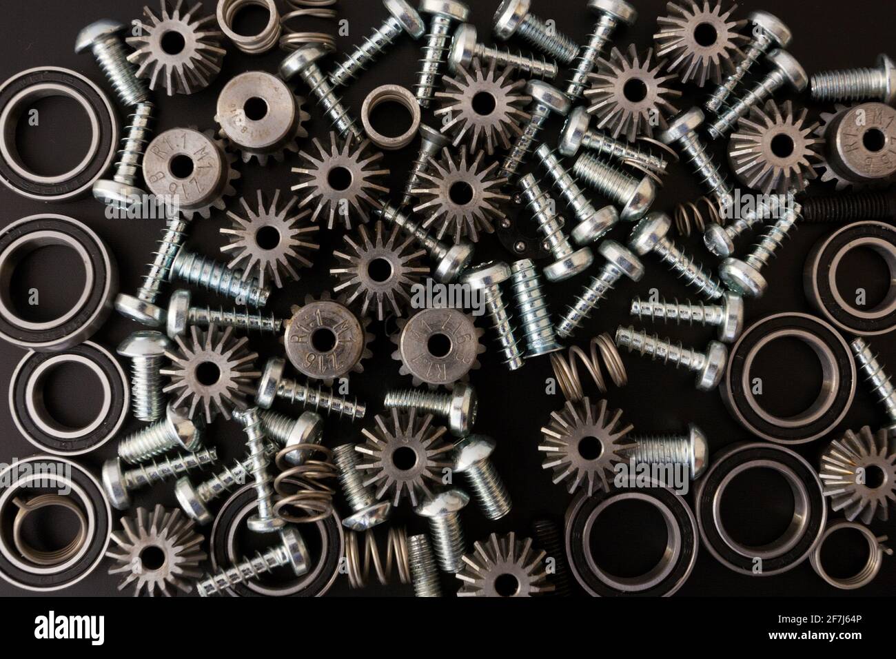 Background with mechanical components, gears, springs, screws ...