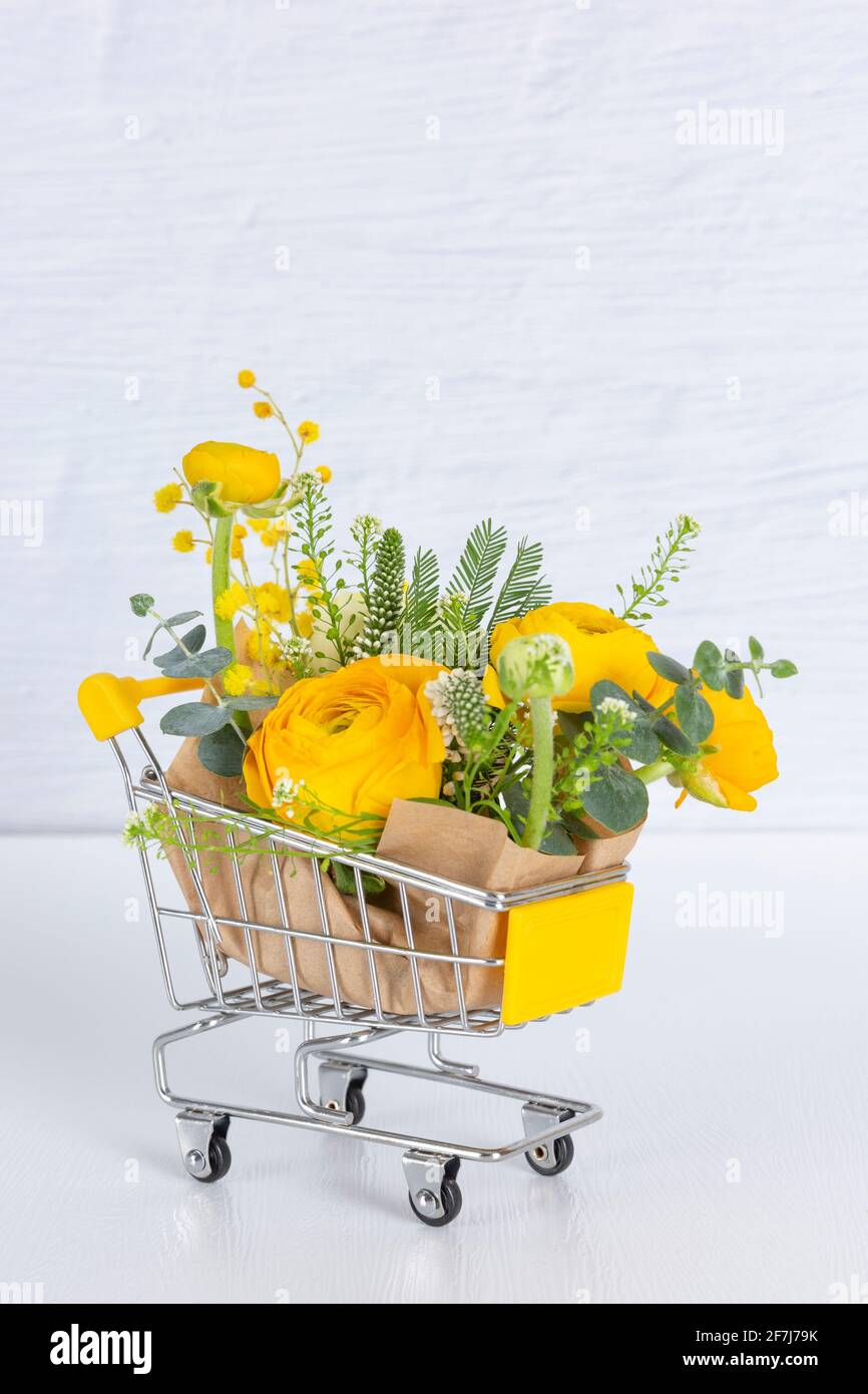 flowers in mini cart, white background Stock Photo - Alamy