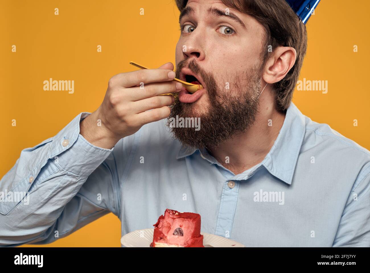 birthday cake man yellow background party candle Stock Photo - Alamy