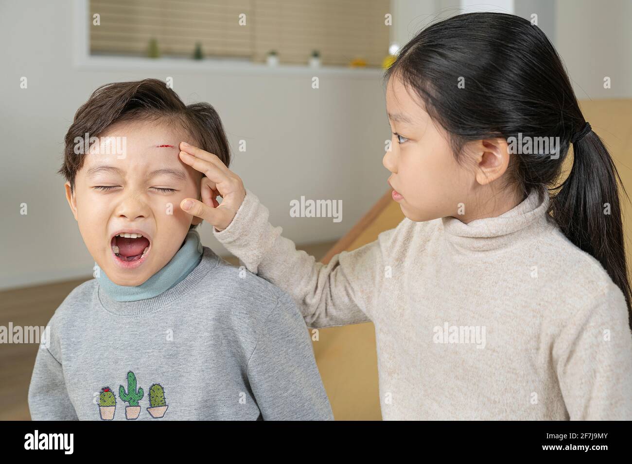Child injury brother hi-res stock photography and images - Alamy
