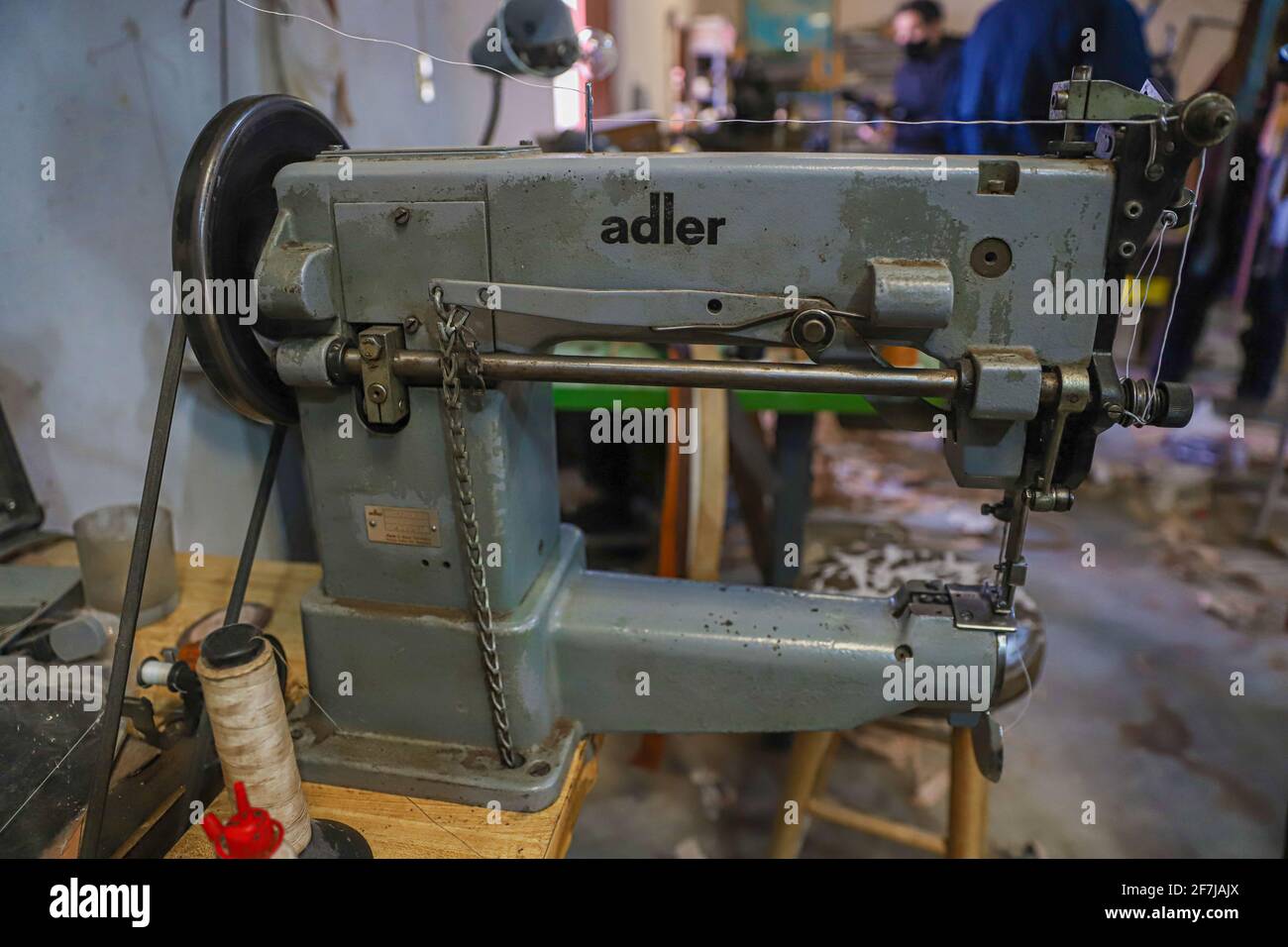 Sewing machine in the factory of boots, saddlery, footwear and leather ...