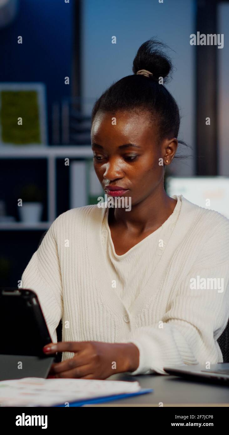 Overworked businesswoman typing financial statistics hi-res stock ...