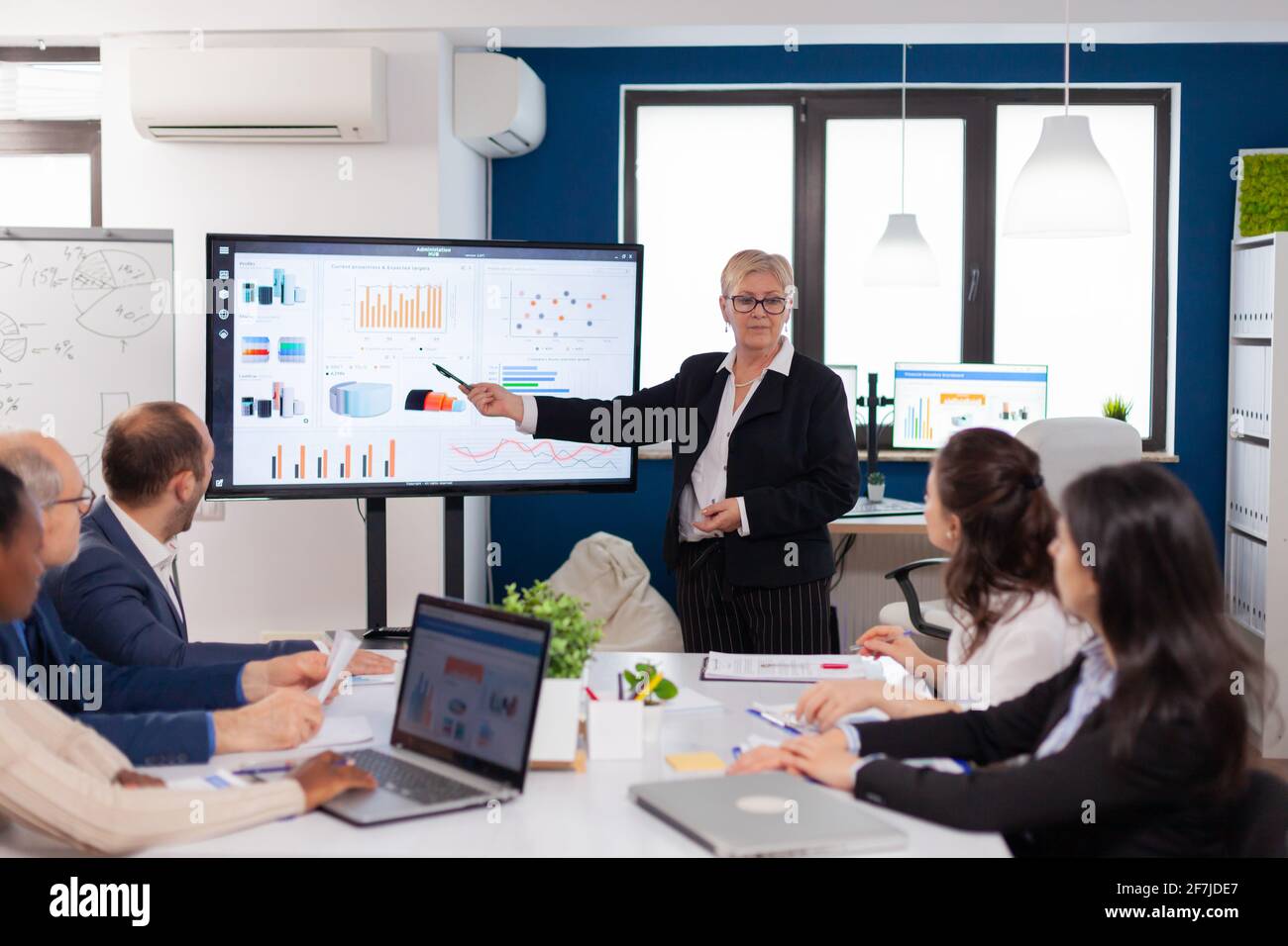 Senior woman company leader brainstorming in conference room Corporate ...