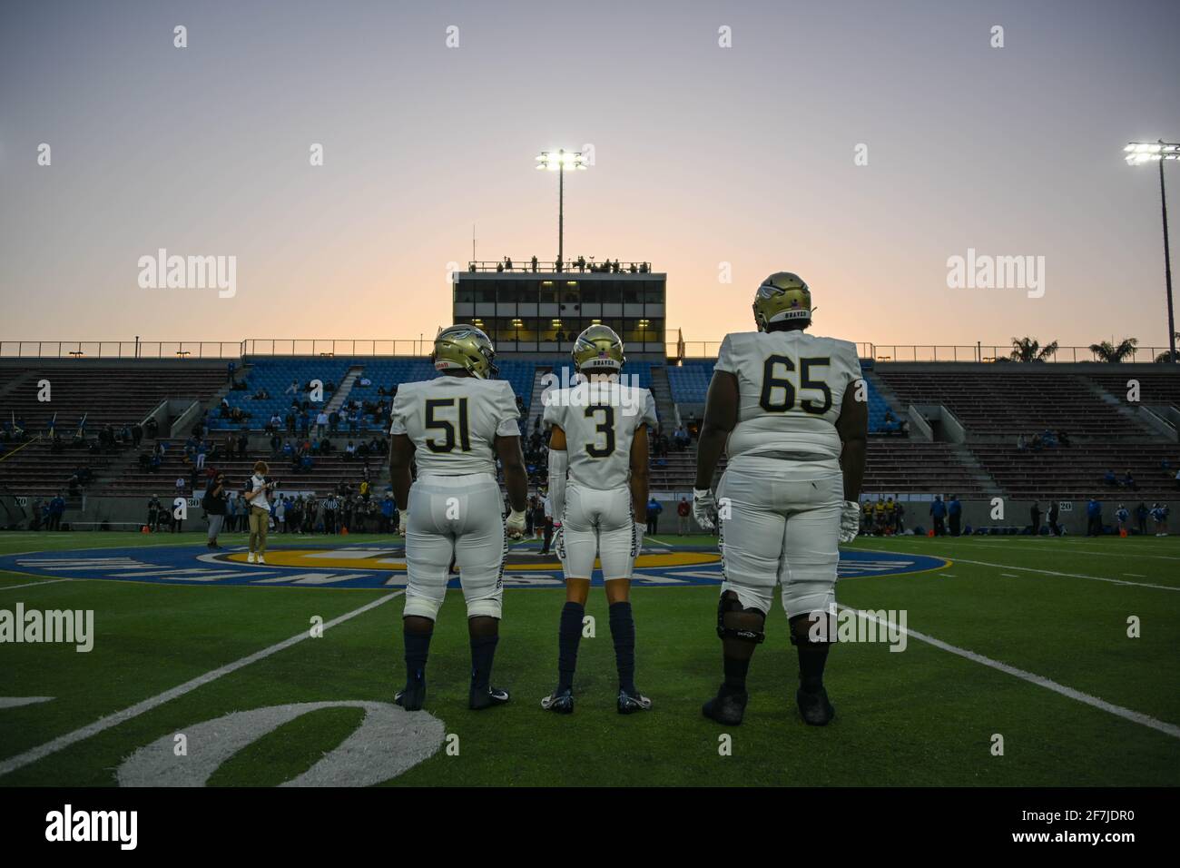 St. John Bosco Braves captains Edward Riley (51), Jode McDuffie (3) and ...