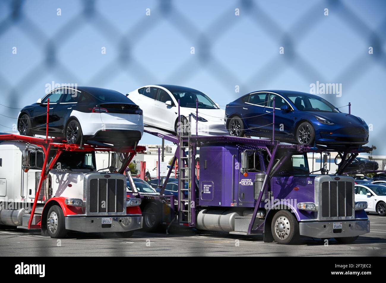 General overall view of Tesla vehicles being loaded onto trucks, Sunday ...