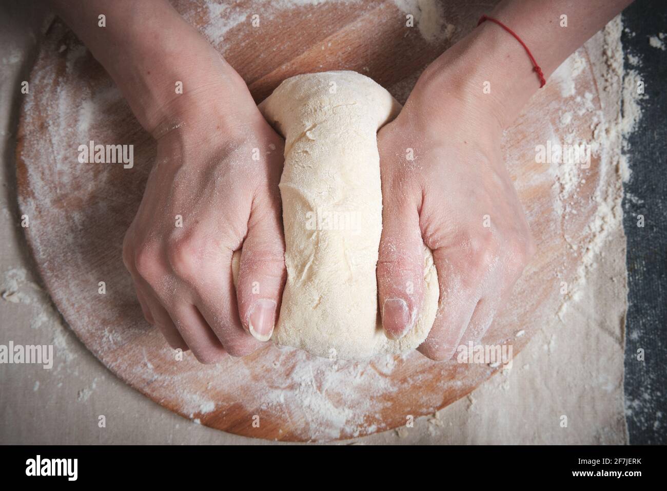 Women's hands knead the dough from wheat flour Stock Photo - Alamy