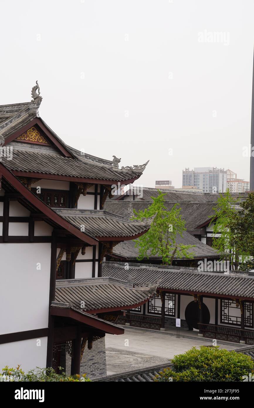 Old house with tile roof in Tai Koo Li with new and tall building ...