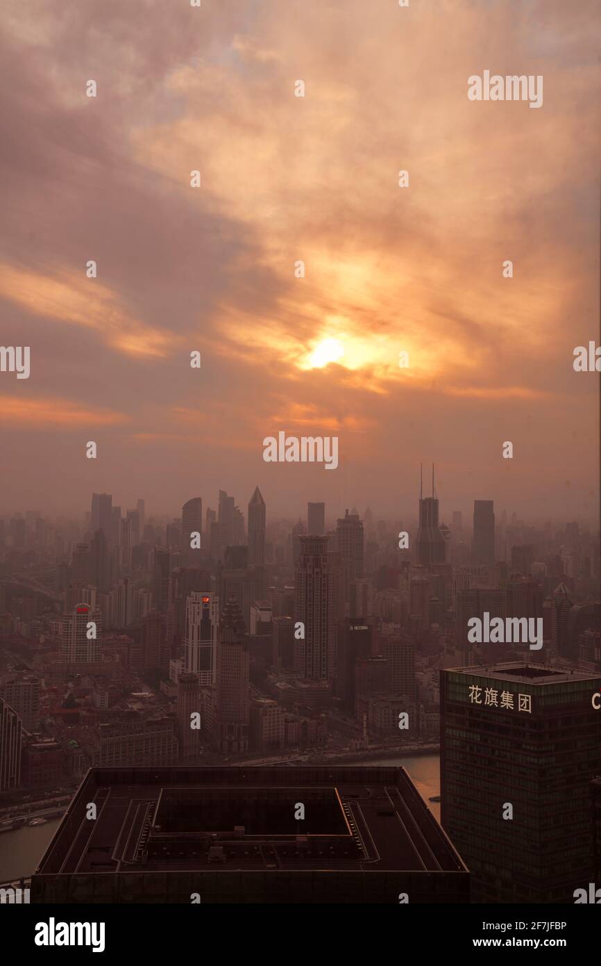 Shanghai city during sunset time with orange sky above Stock Photo - Alamy