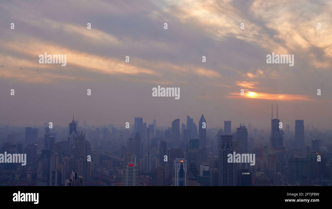 Shanghai city during sunset time with orange sky above Stock Photo - Alamy
