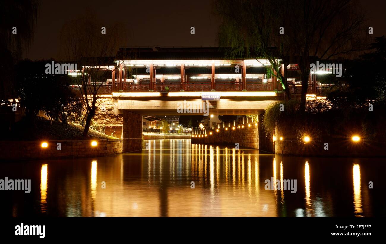 Bridge lights on and its reflaction on river Stock Photo - Alamy