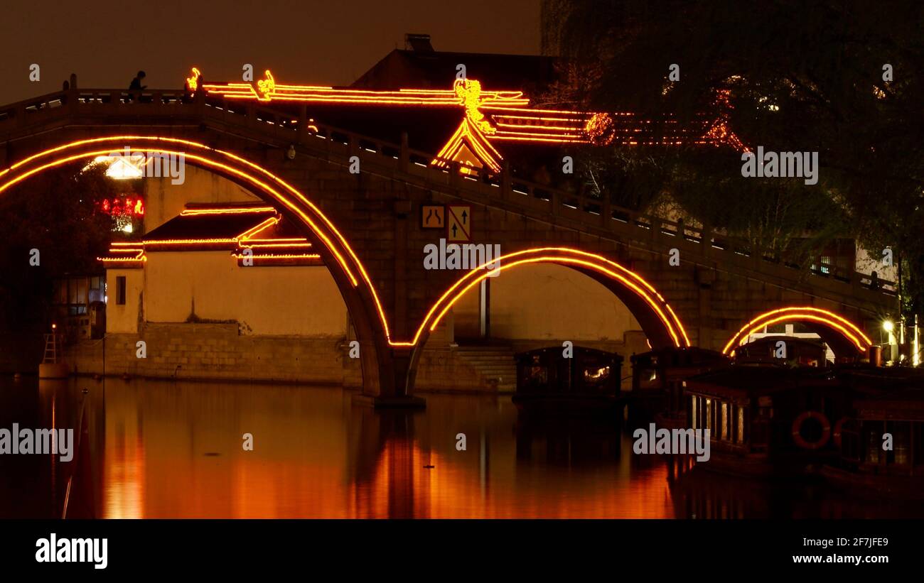 Bridge lights on and its reflaction on river Stock Photo - Alamy