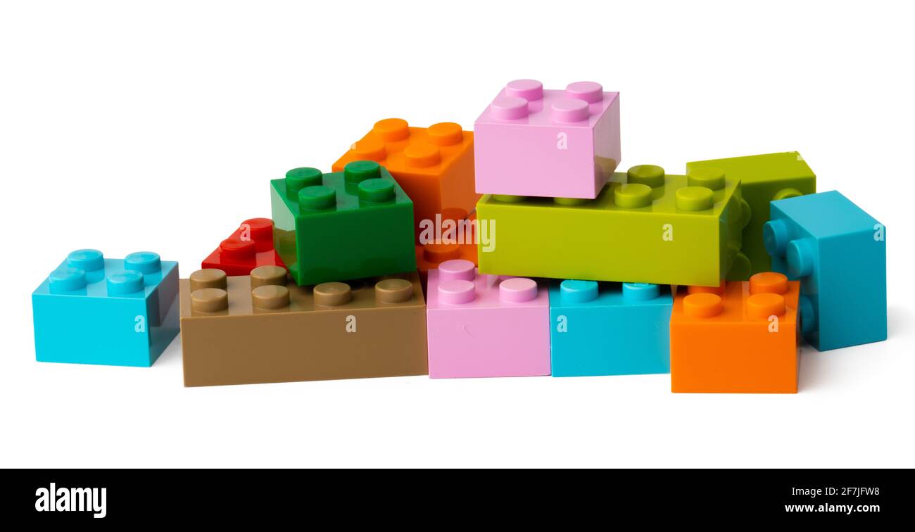 Colorful plastic toy building blocks isolated on white Stock Photo - Alamy