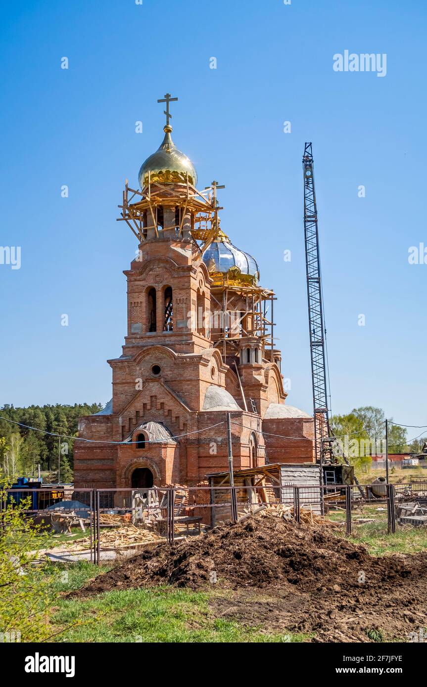 A church with a gilded dome under construction Stock Photo - Alamy