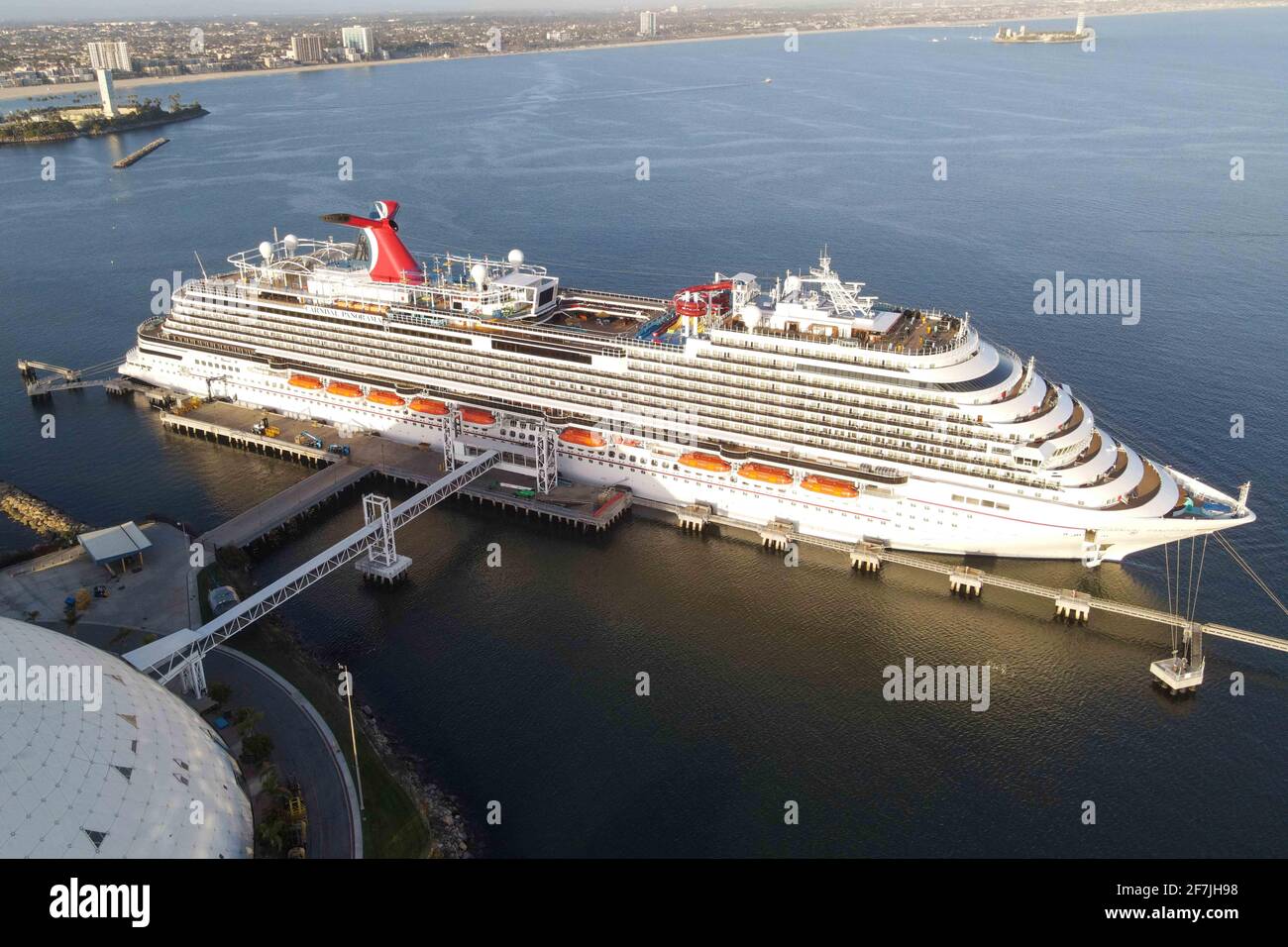 The Carnival Panorama cruise ship is docked near the Queen Mary in the ...
