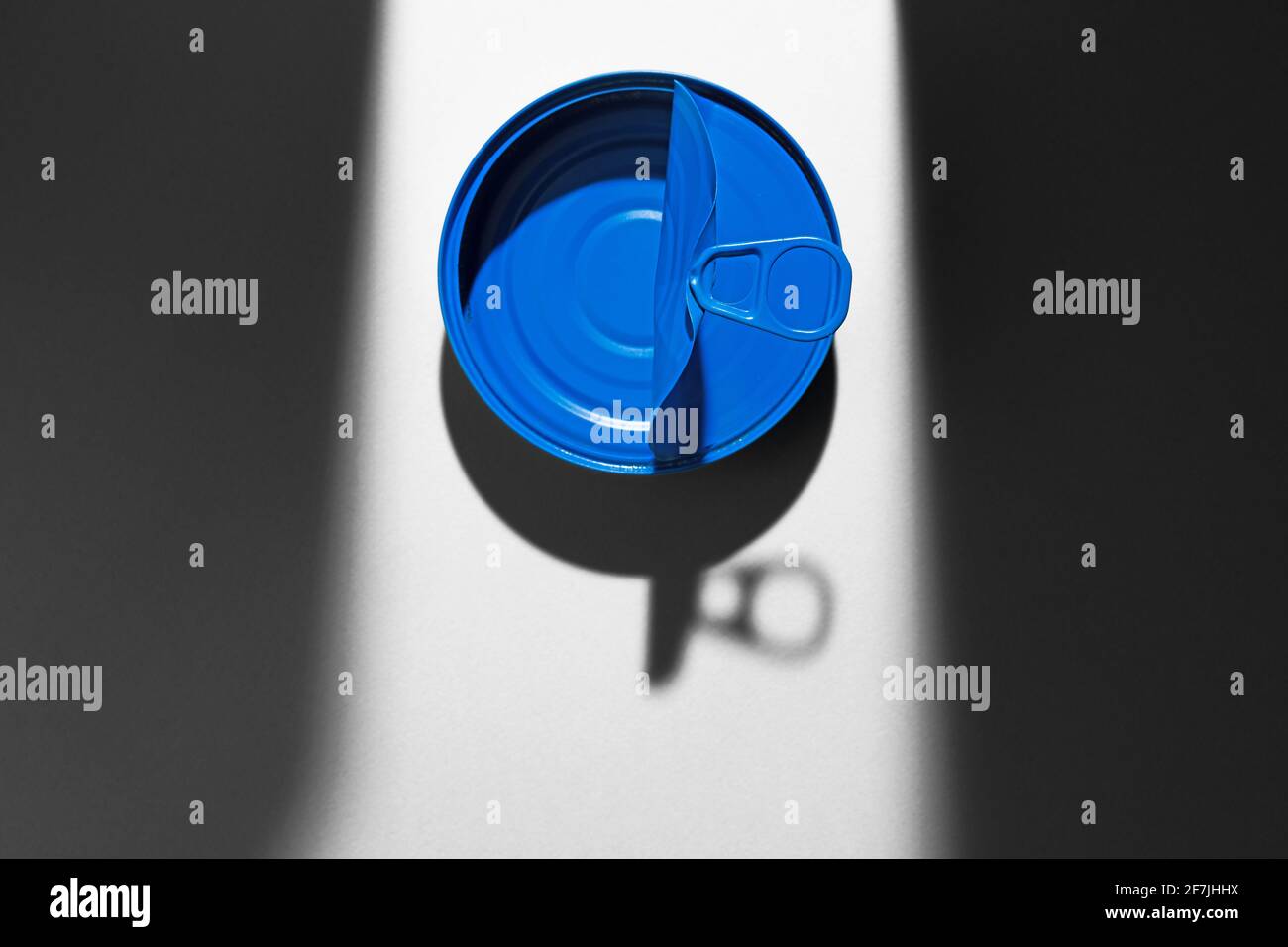 Painted blue opened tin can with ring on white background Stock Photo ...