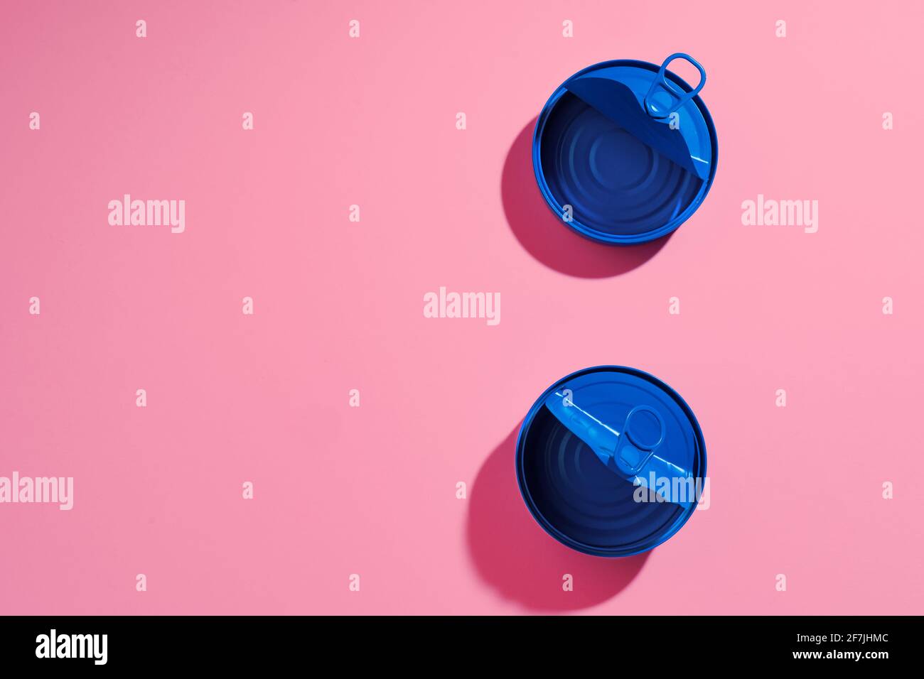 Aesthetic concept with blue painted tin can on pink background Stock ...