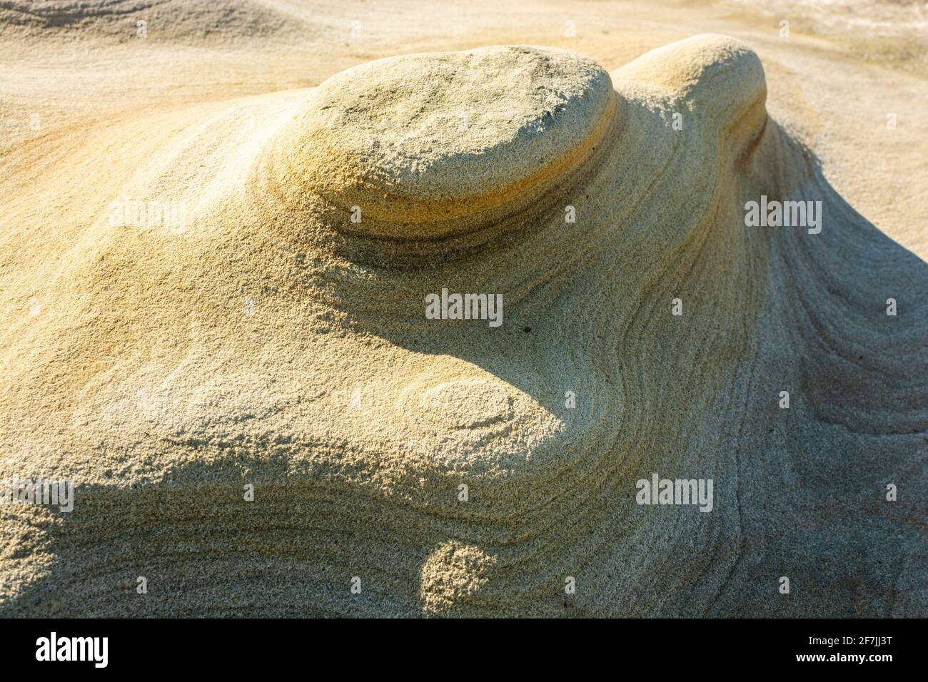 Rock formations of sandstone and other materials on the coast of the ...