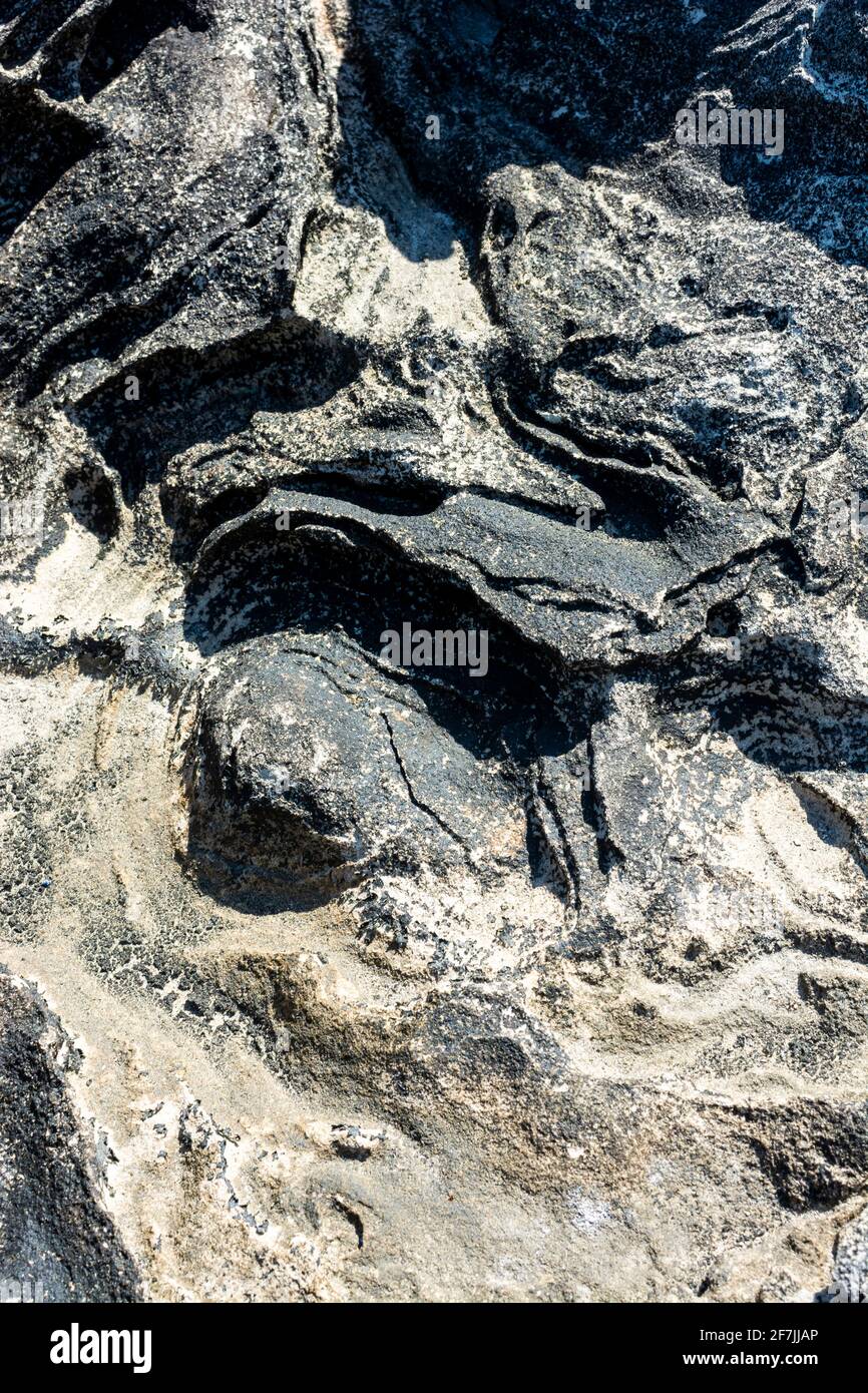 Rock formations of sandstone and other materials on the coast of the ...