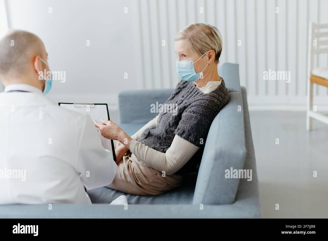 doctor and patient sitting on the couch in the medical office Stock ...