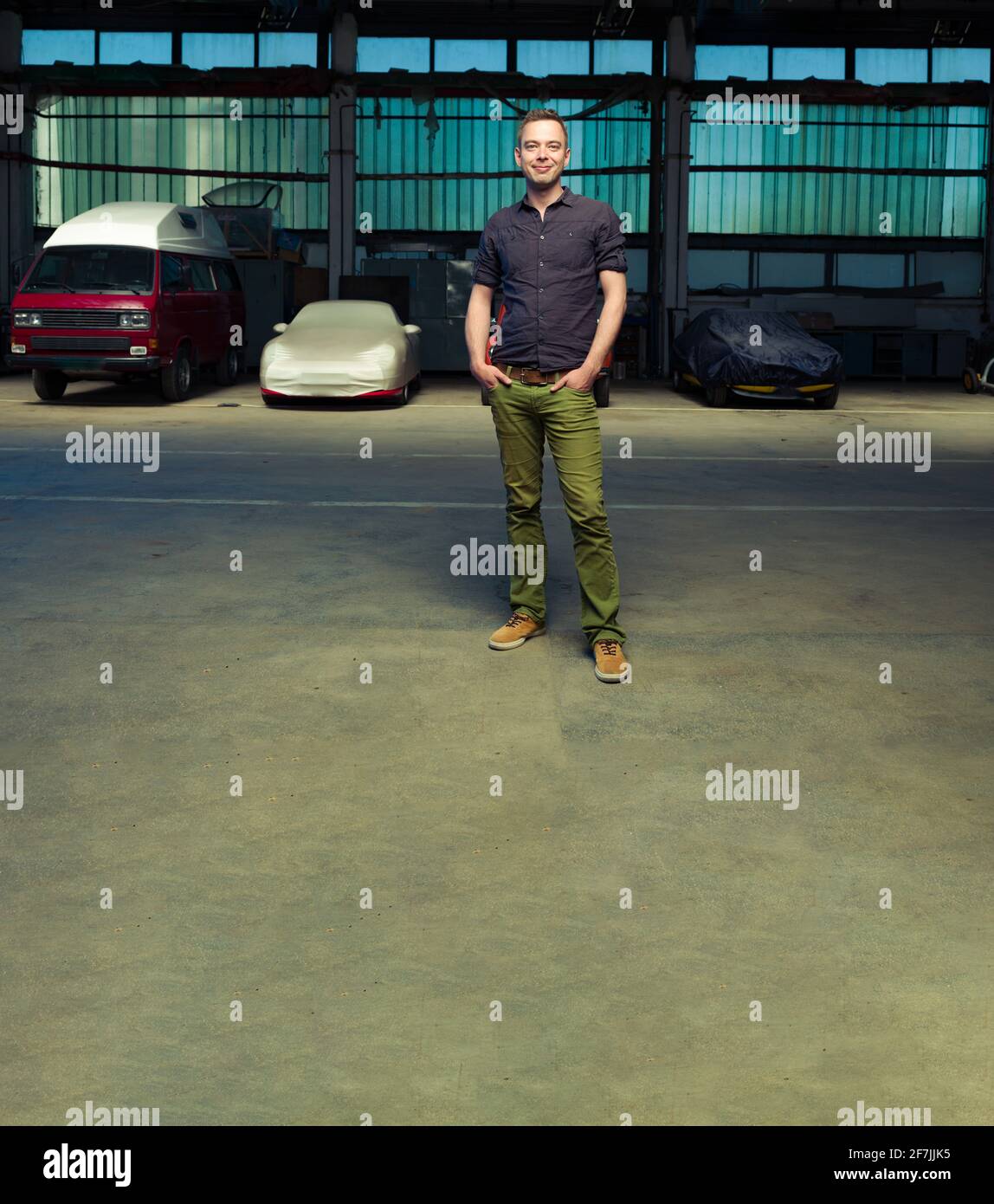 Classic car owner in his garage Stock Photo - Alamy