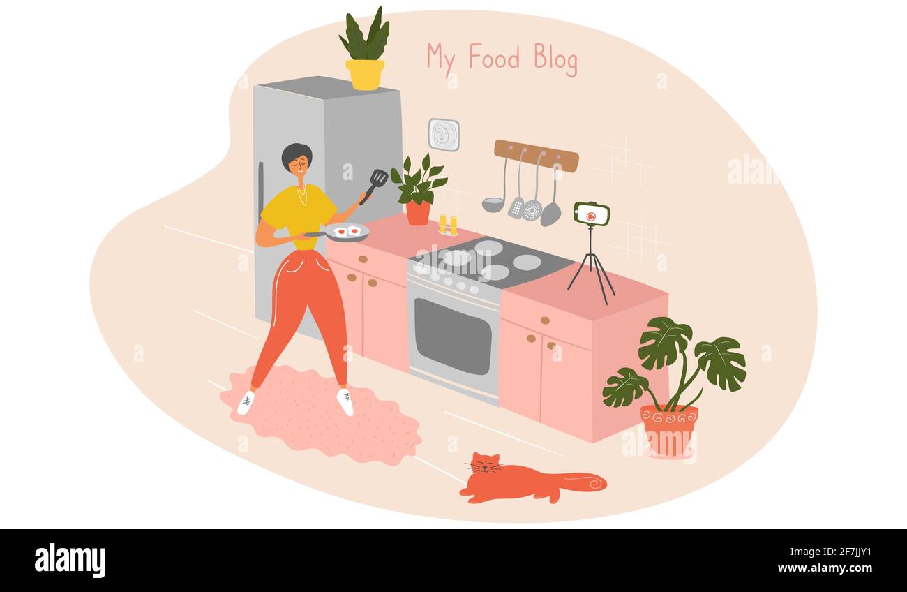 Food blogger. Young woman records video. Chef is cooking in kitchen ...