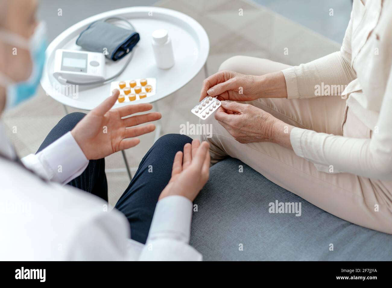 Doctor visiting patient in living hi-res stock photography and images ...