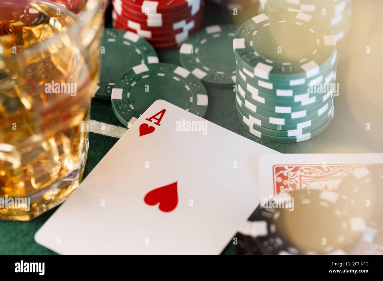Cards, playing chips and alcohol in glass Stock Photo - Alamy