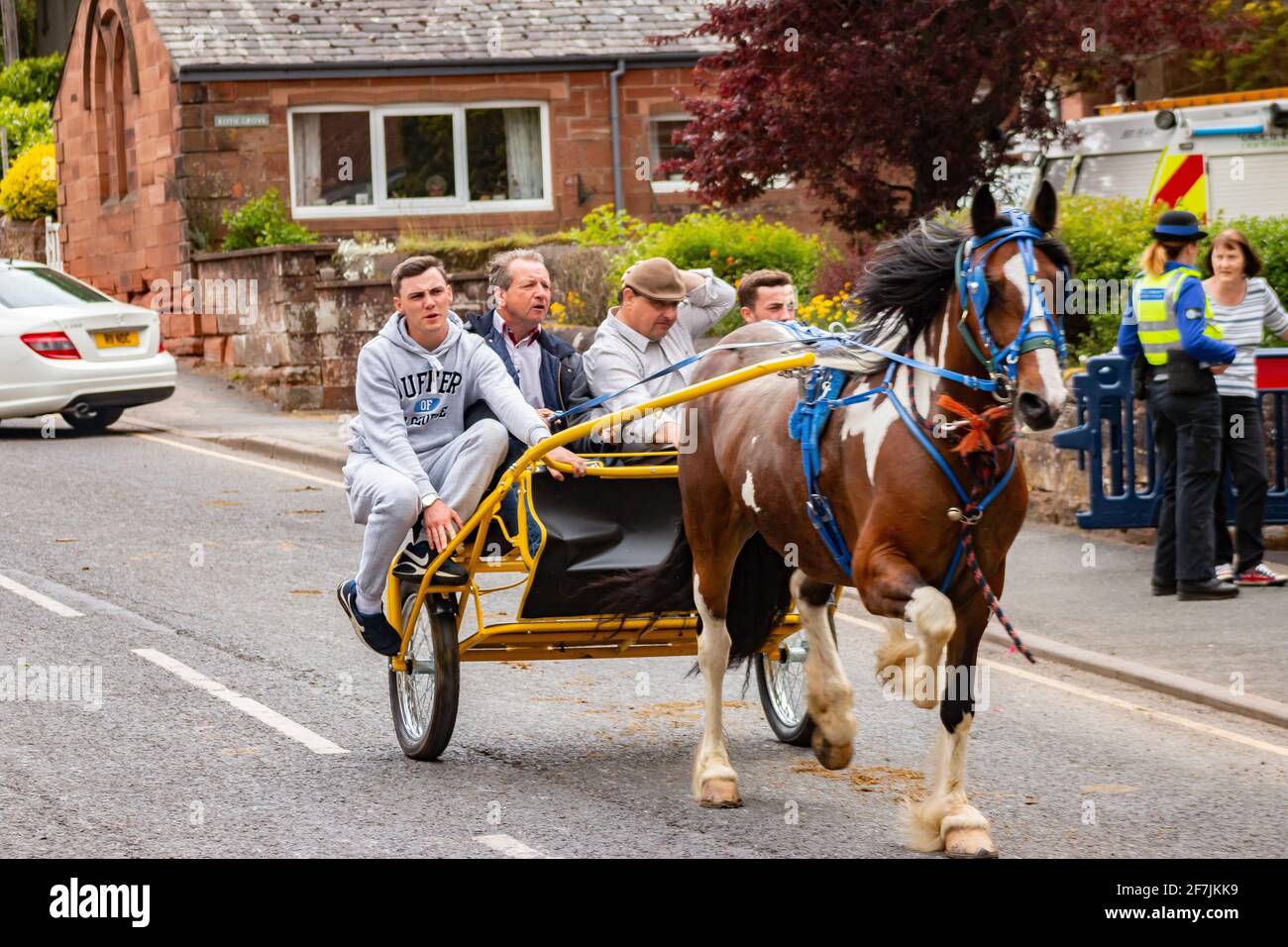 gypsy Romany men man leading horses and buggy pony trap during Appleby ...