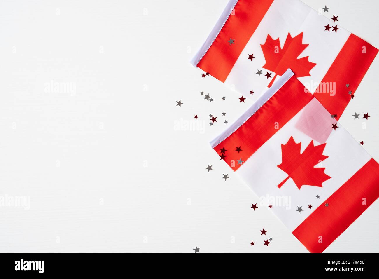 Happy Canada Day banner design. Canadian flags and confetti on white ...
